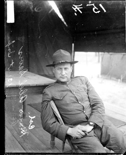 ECC | [Colonel Abel Davis sitting in a chair in a tent at Camp Log