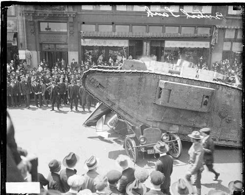 ECC | [British tank running over top and crushing automobile, larg