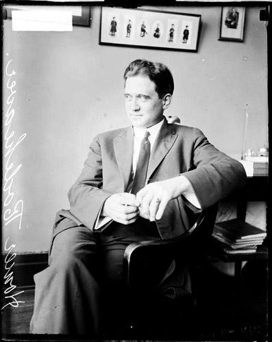 ECC | [Homer Rodeheaver sitting in a room, light exposure]