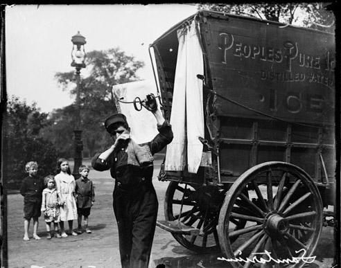 ECC | [Daily News sanitarium ice man carrying a large block of ice