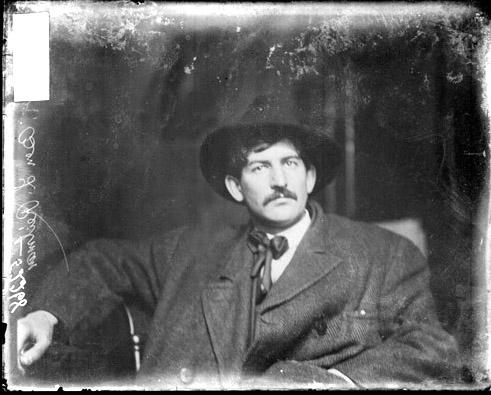 ECC | [Dr. Ben L. Reitman, with one elbow resting on the back of h