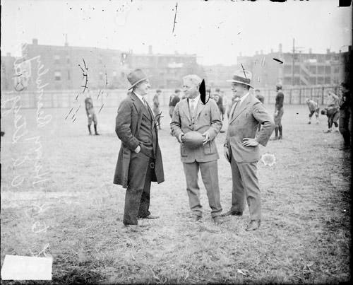 ECC | [Hal Totten, Amos Alonzo Stagg, and Harry Beardsley standing