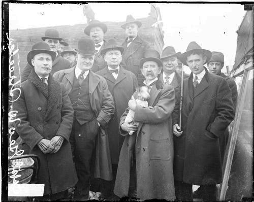 ECC | [Captain George Wellington Streeter holding dog, standing wi