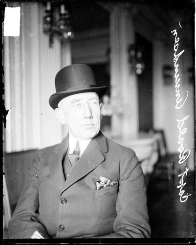 ECC | [Captain Roald Amundsen, Antarctica explorer, sitting in a c