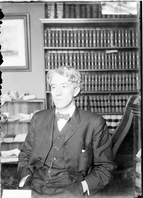 ECC | [Judge Kenesaw Mountain Landis, sitting in a room with books