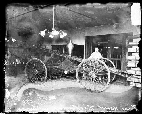 ECC | [First hand-operated fire engine in Chicago, in a room at Ch