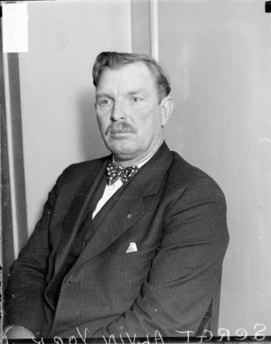 ECC | [Sergeant Alvin York sitting in a chair in the corner of a l