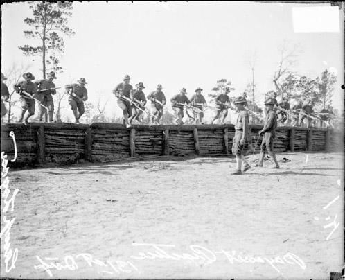 ECC | [131st Infantry near wall at Camp Logan]