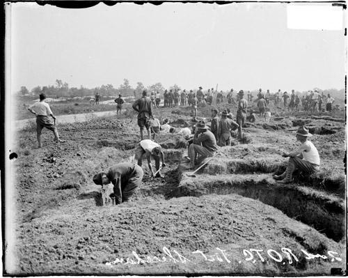 ECC | [ROTC soldiers digging trenches with shovels at Fort Sherida