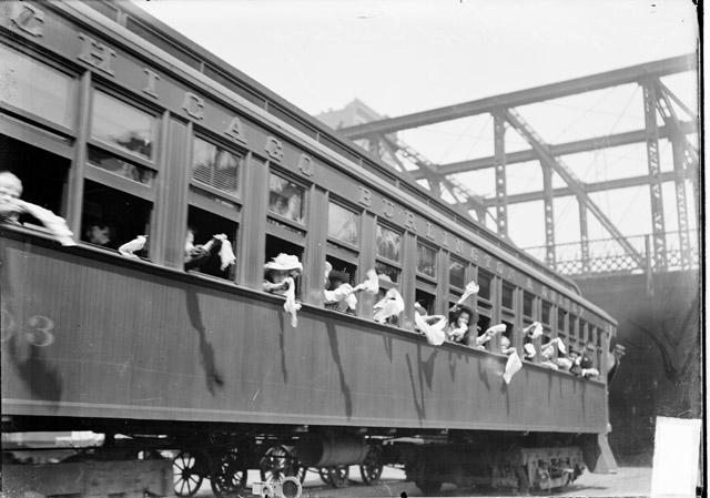 ECC | [Children on a train waving handkerchiefs out of the windows