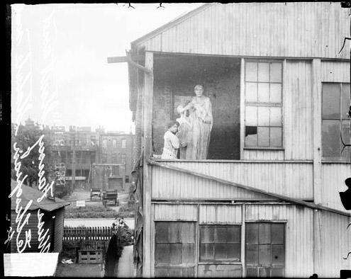 ECC | [African American sculptor, Fanny Stout, standing on a tenem