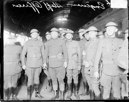 ECC | [13th Engineers Division staff officers standing next to tra