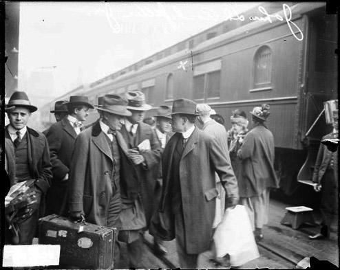 ECC | [John D. Rockefeller, Jr., standing by a train car in Union