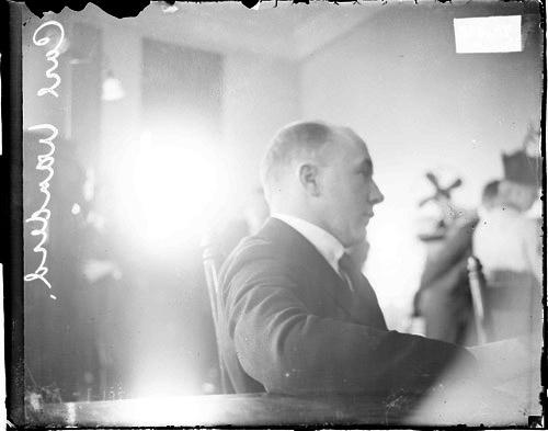 ECC | [Former Lieutenant Carl Wanderer sitting in chair at table i