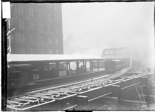 ECC | [Canal Street elevated railroad station, with a train moving
