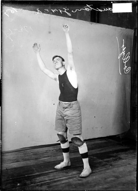 ECC | [Evanston YMCA basketball player Collyer, posing in front of