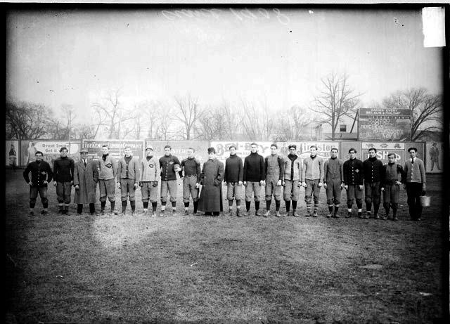 ECC | [Crane High School football team standing on an athletic fie