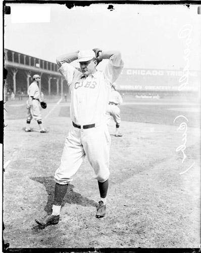 ECC | [Baseball player, Overall, Cubs, winding up to throw a baseb