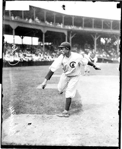 ECC | [Baseball player Cheney, Cubs, following through after throw