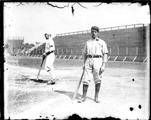 ECC | [Baseball player Doyle, New York, holding a baseball bat, st