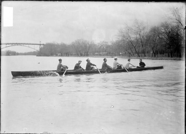 ECC | [Rowers, Lincoln Park Rowing Club, in a shell on a body of w