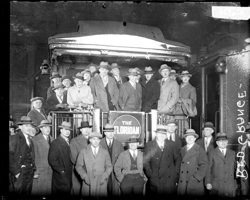 ECC | [Football player Harold Grange and a large group of men stan