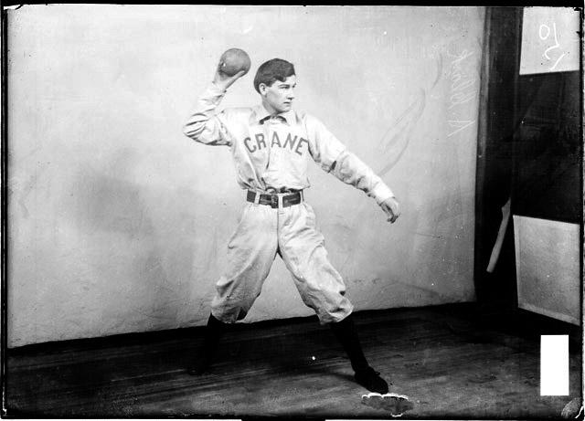 ECC | [Crane indoor baseball player A. Clark, holding a ball near