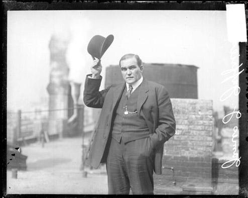 ECC | [Boxer, James J. Jeffries holding his hat above his head, st
