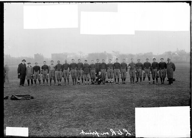 ECC | [Football team, Crane High School, standing abreast on an at