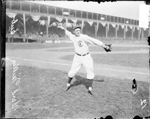 ECC | [Baseball player Miller, Cubs, cocking his arm to throw a ba