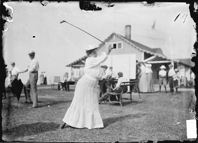 ECC | [Golfer Miss O. Lindman, with a golf club raised over her he