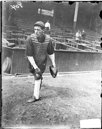 ECC | [Baseball catcher Chapman, Cubs, following through after thr