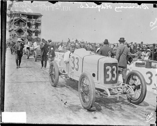 ECC | [Auto racer, Barney Oldfield and mechanic stting in race car