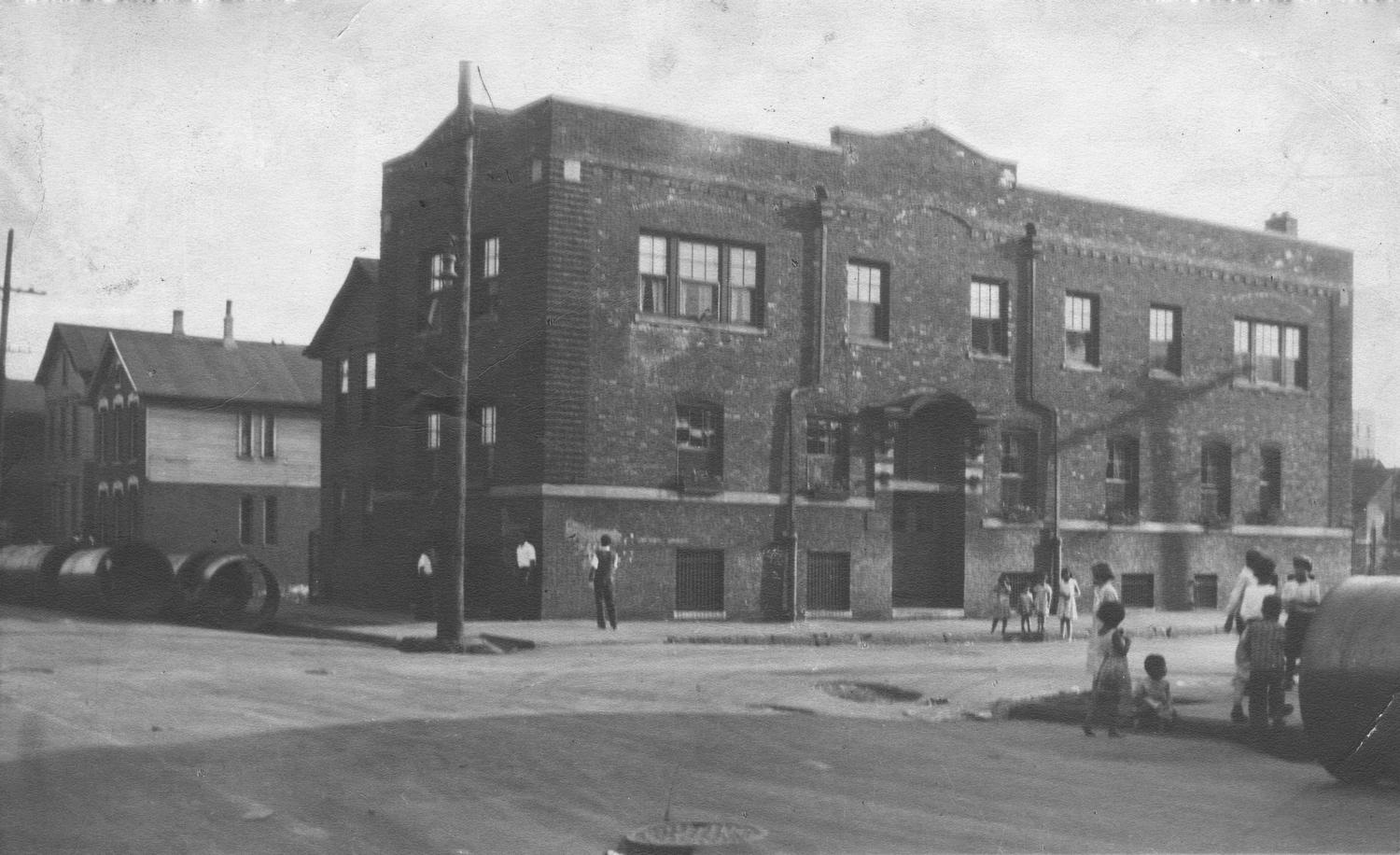 ECC | Children playing in front of Henry Booth House