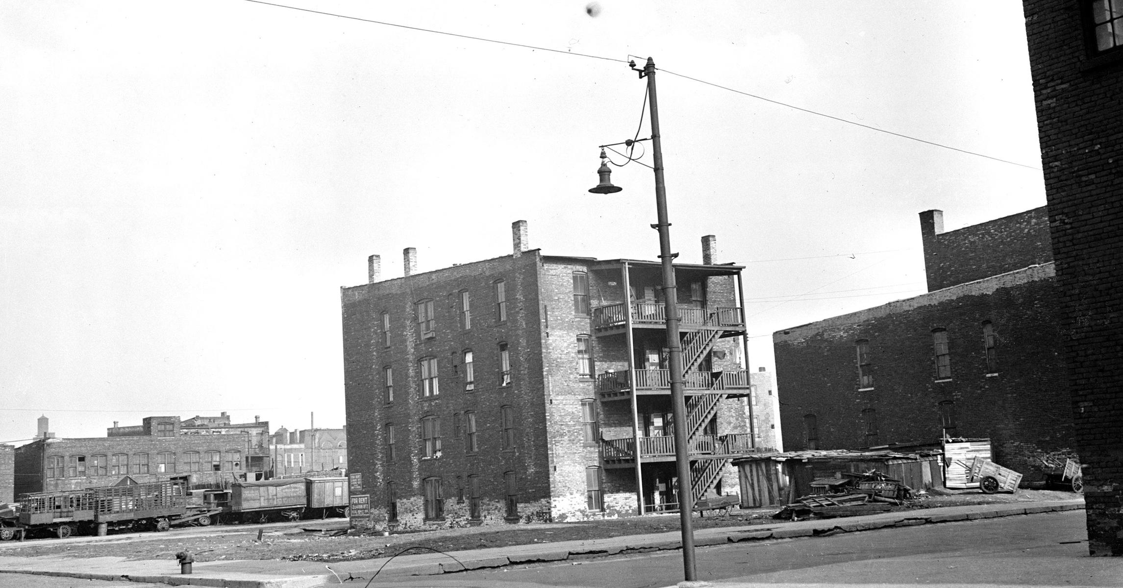 ECC | Rear view of a three-story apartment building